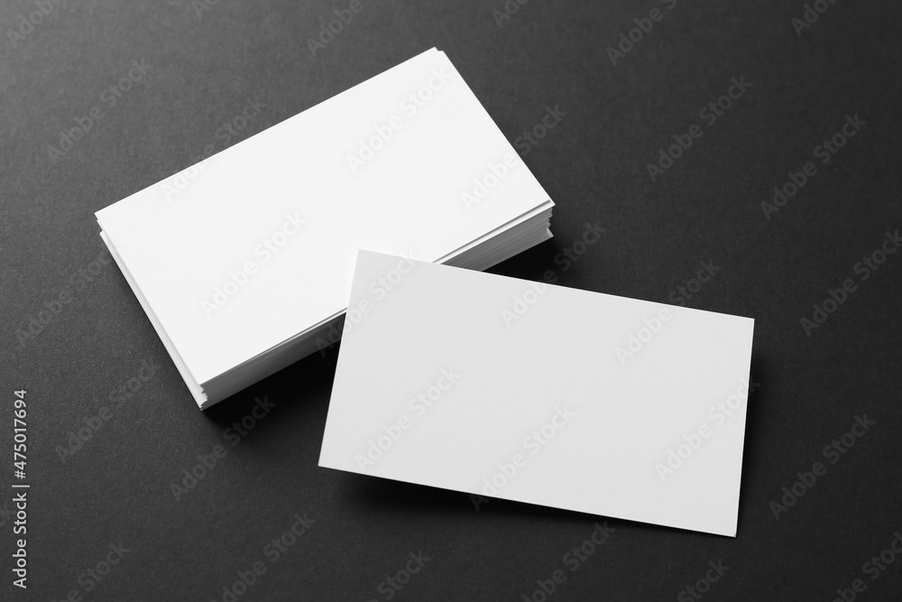 Blank business cards on black background, above view. Mockup for design ...