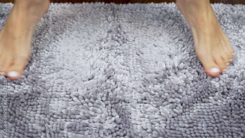 Jumping Dancing Feet of a Woman on a Puffy Bath Rug, Close-up. Woman ...