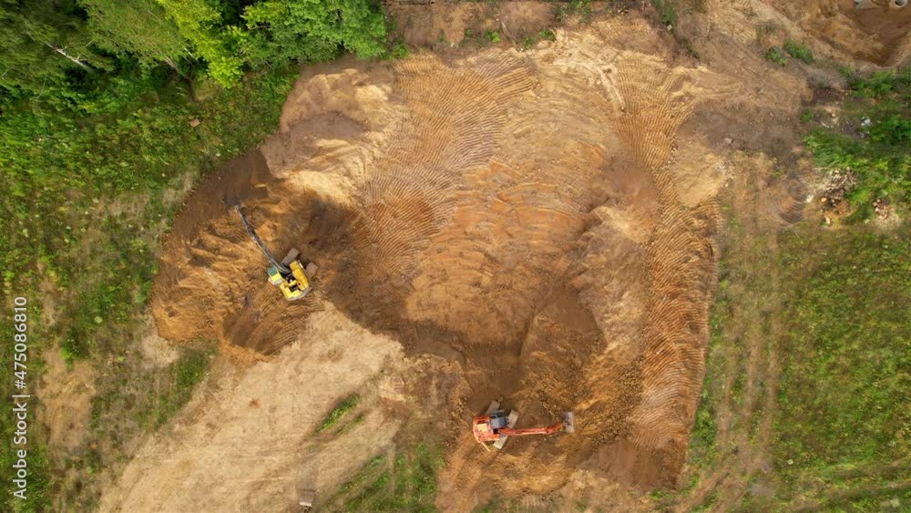 Excavator dig ground at construction site. Foundation pit for a multi ...