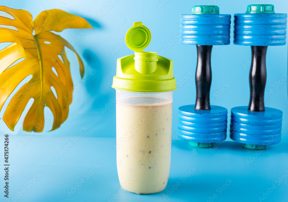 Protein sports shaker. Protein drink and dumbbells. Sports screensaver ...