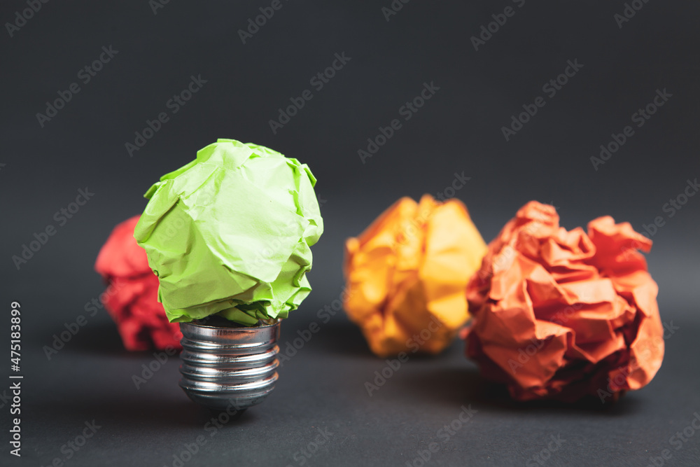 crumpled paper light bulb on black background Stock Photo | Adobe Stock