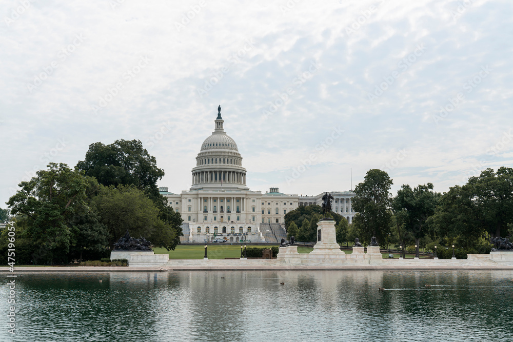 Neoclassical architecture of the Capitol dome building over reflecting ...