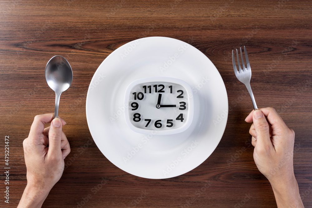 Eat meal time healthy eating concept hand hold spoon and fork Stock ...