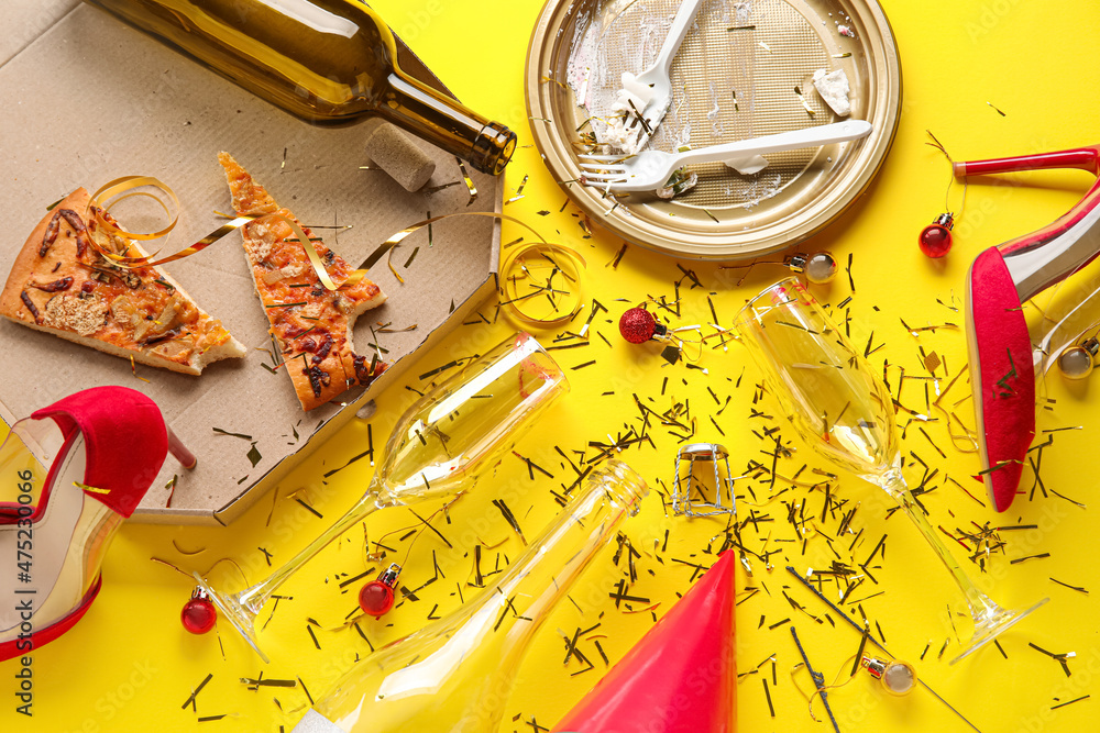 Composition of after party mess on color background. Christmas ...