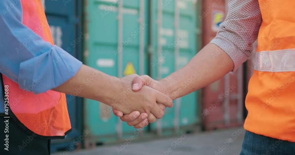 Close up of handshake in construction site industrial worker on factory ...