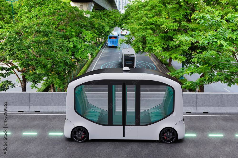 Autonomous electric shuttle bus self driving across city green road ...