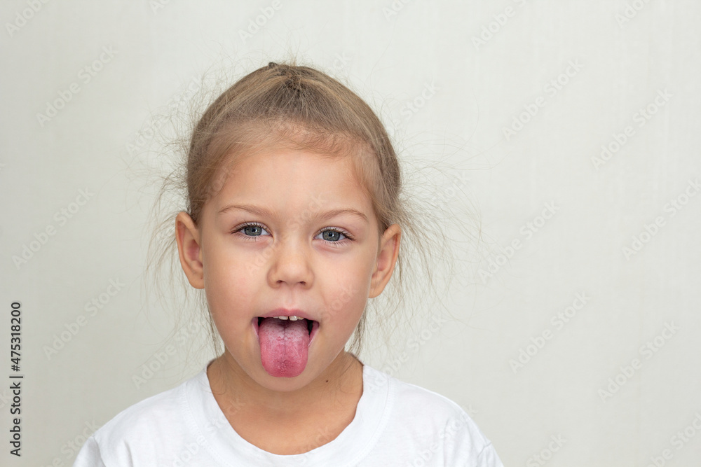 Isolated funny child sticking out tongue on white background Stock ...