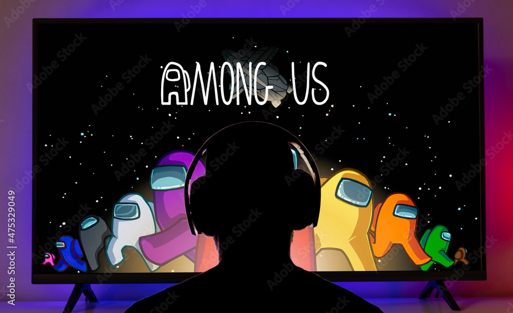Man play Among Us with headphones. Among Us releasing for consoles for ...