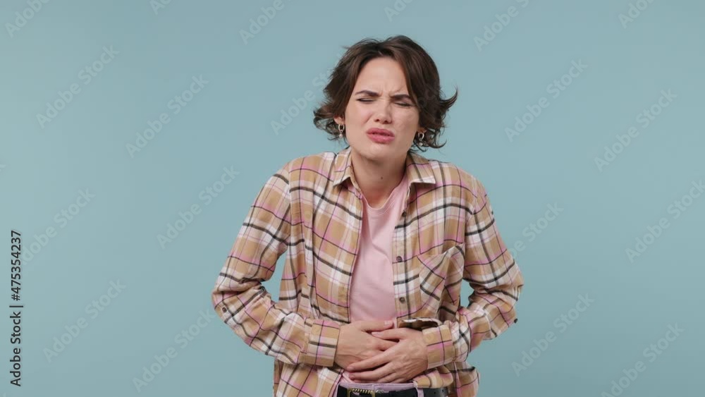 Sick ill sad tired young brunette woman 20s wears plaid shirt put hands ...