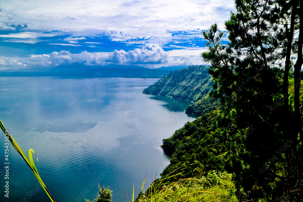 The beauty of Lake Toba which is a caldera lake comes from an ancient ...