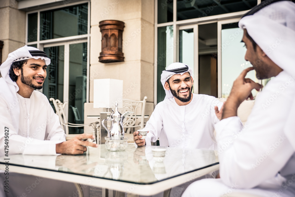 Image of a group of friends from the emirates meeting in Dubai. Young ...