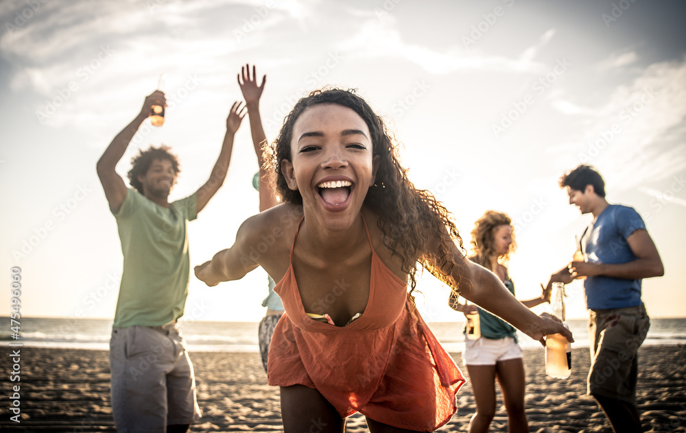 Group of friends having fun on the beach in Los angeles. Storytelling ...