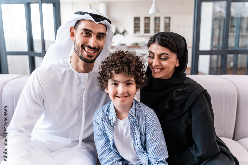 happy family spending time together at home during the Dubai national ...