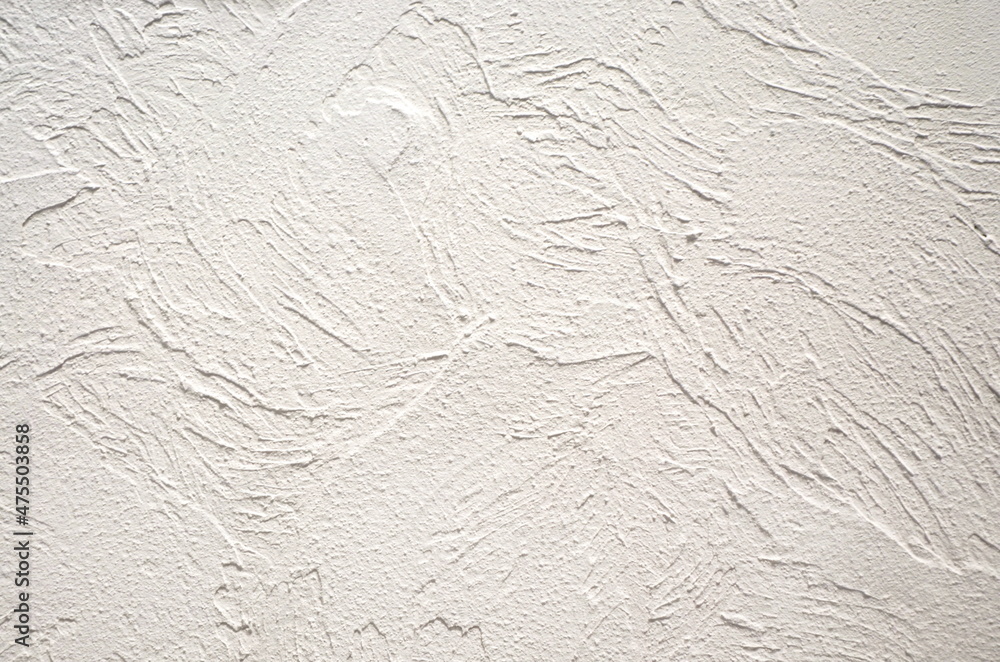 White textured plaster on the walls. Home decoration for interior ...