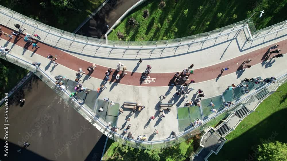 Aerial top view on pedestrian glass bridge with a crowd of walking ...