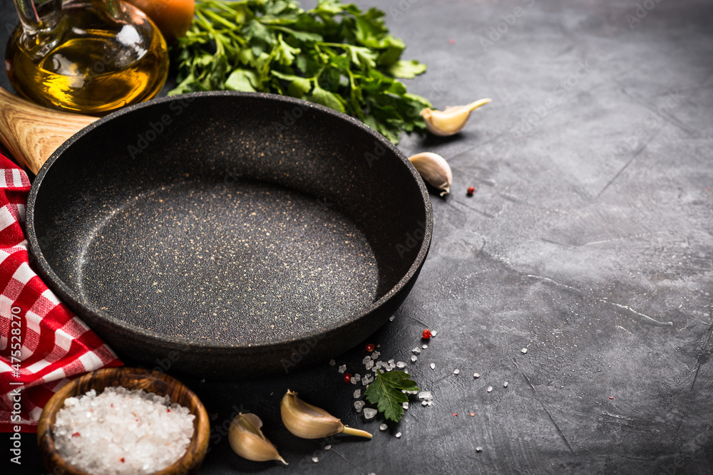 Food cooking background with Frying pan or skillet, spices, herbs and ...
