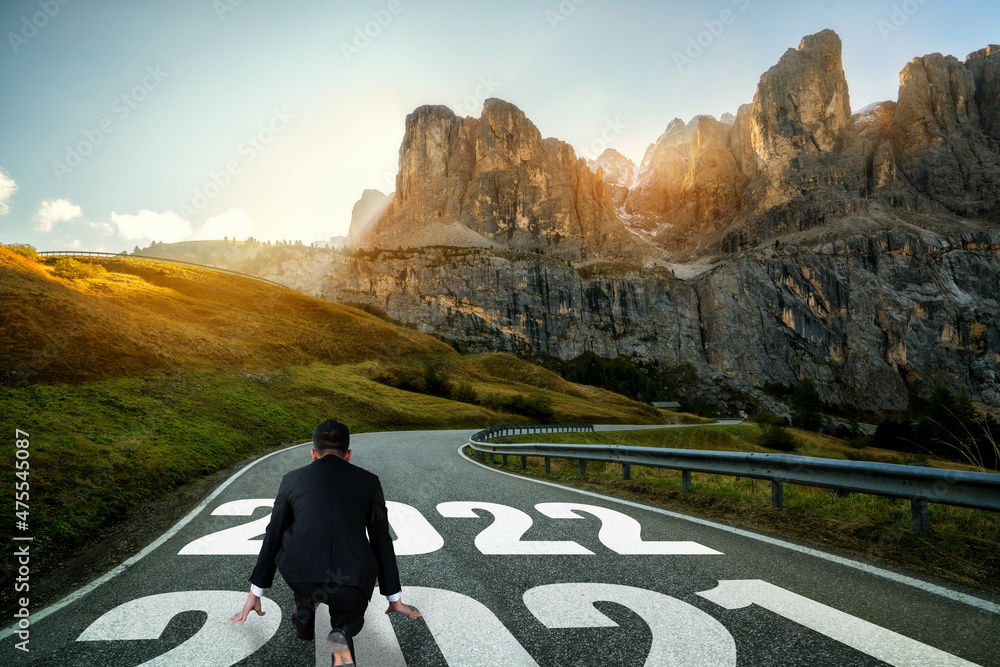 The 2022 New Year journey and future vision concept . Businessman ...