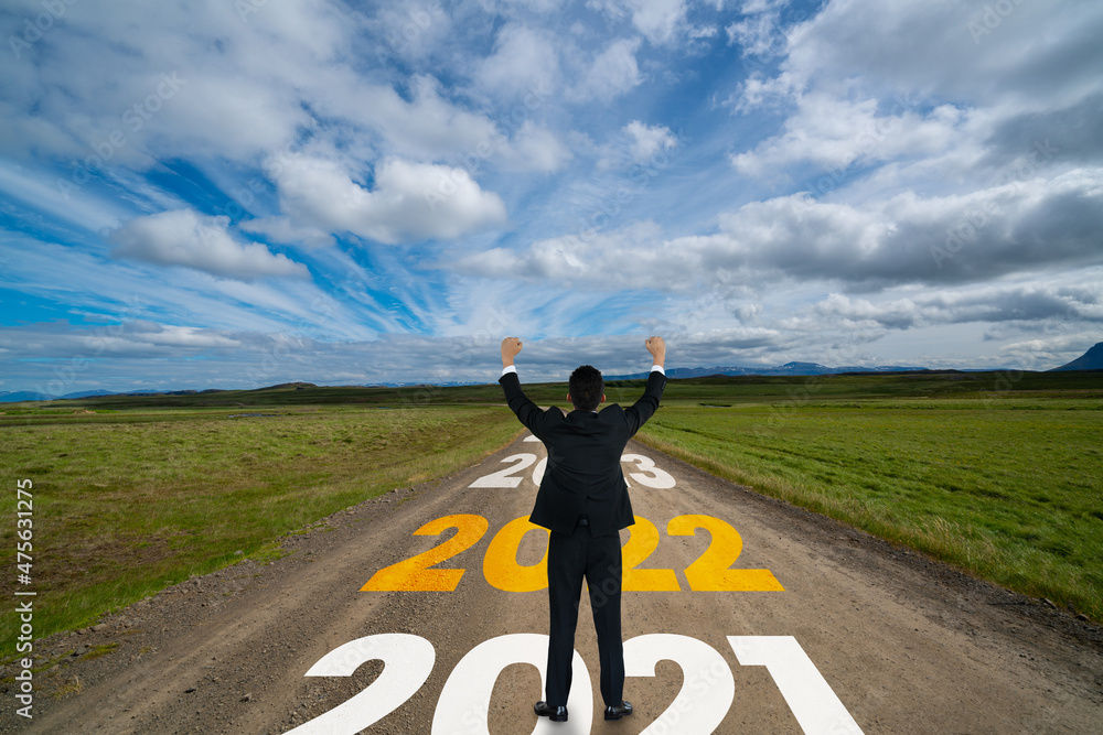 The 2022 New Year journey and future vision concept . Businessman ...