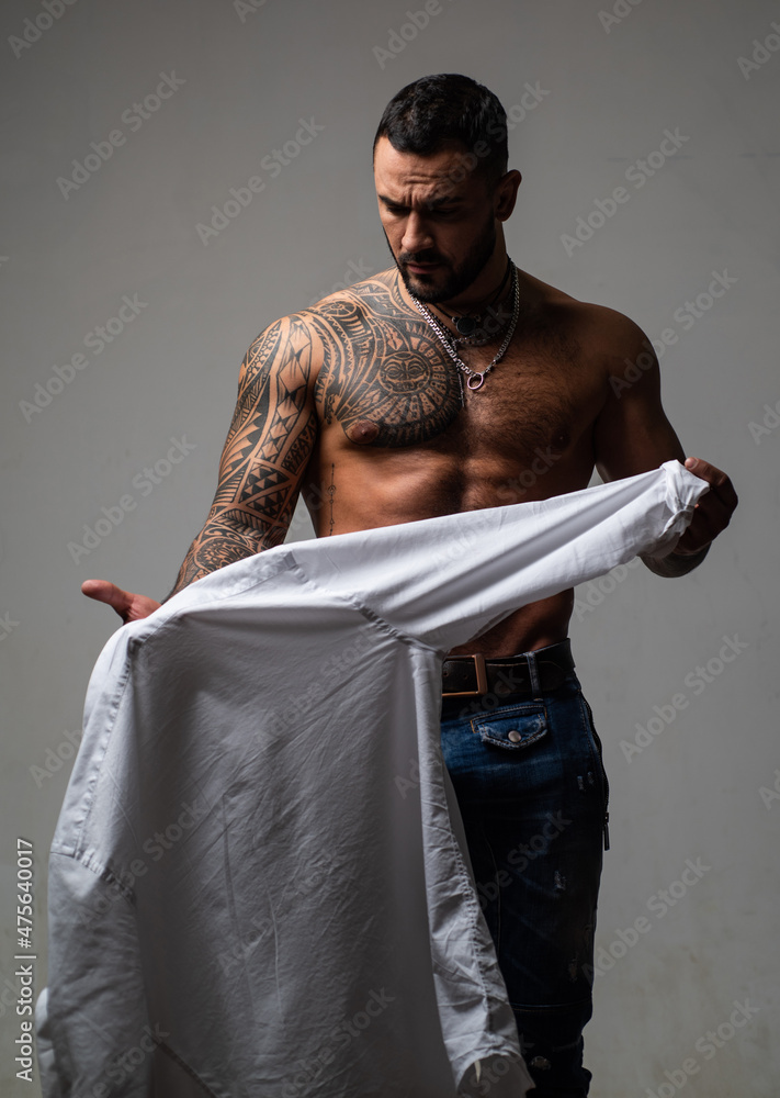 Sexy man undressing shirt. Sexual desire. Sensual guy. Stock-Foto ...