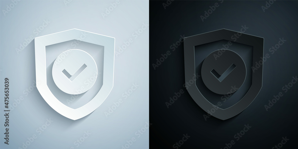 Paper cut Shield with check mark icon isolated on grey and black ...