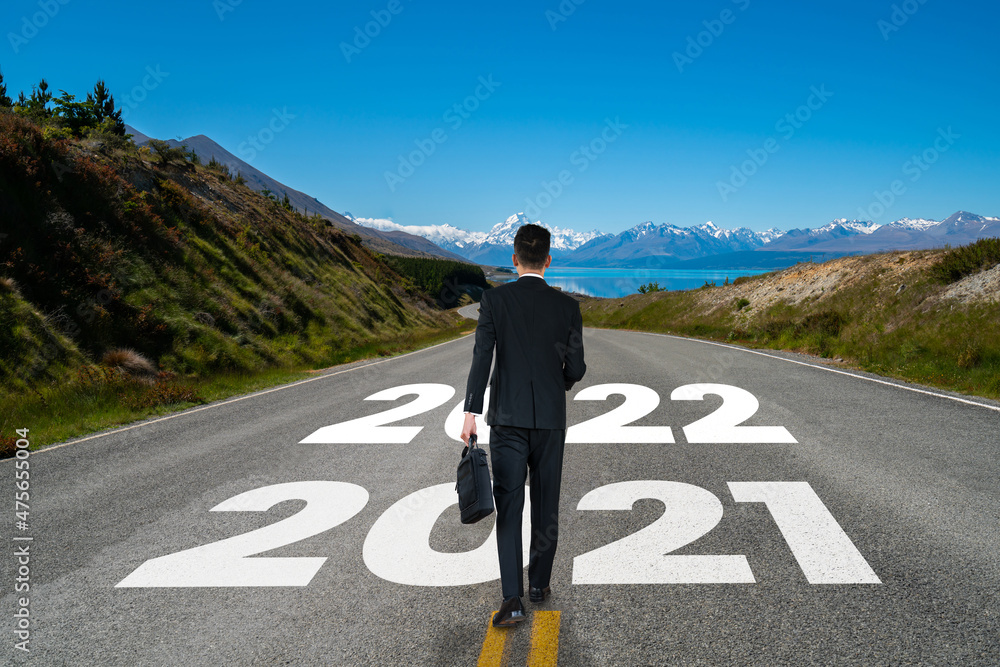 The 2022 New Year journey and future vision concept . Businessman ...