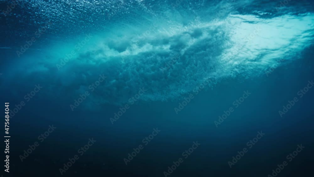 Ocean wave. Crystal clear ocean wave rolls and breaks. Underwater view ...