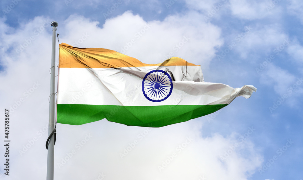 Indian flag waving on a pole in a blue sky Stock Photo | Adobe Stock