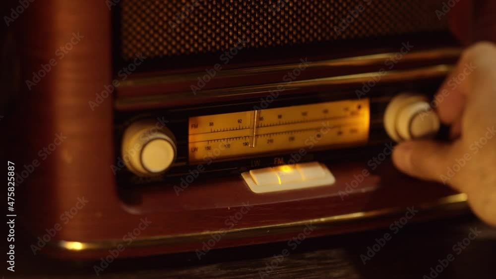 Vintage wooden retro radio receiver, macro shot of manual tuning of ...