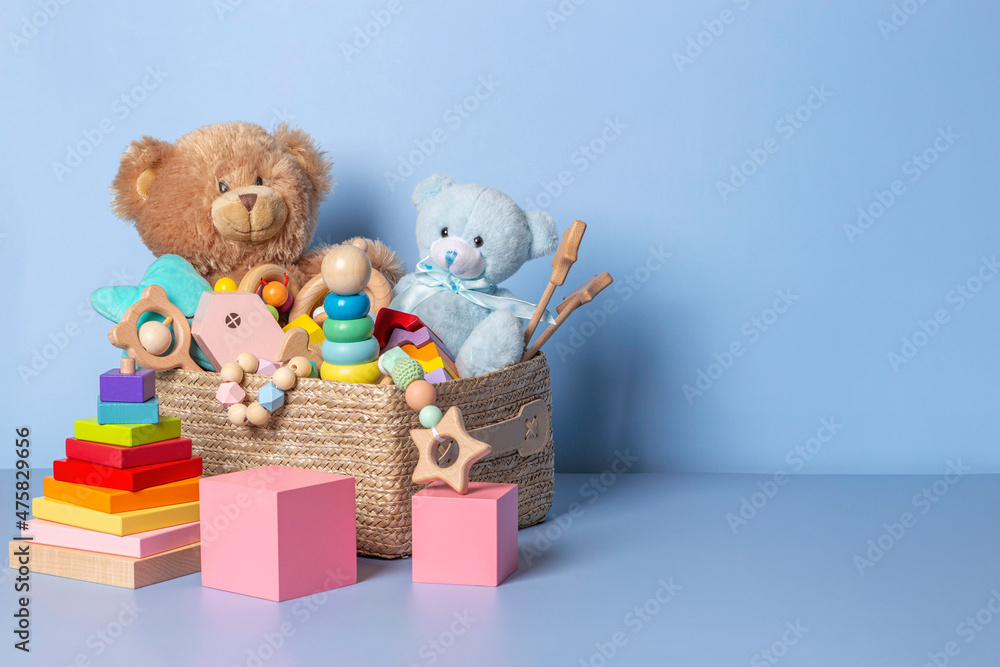 Toy box full of baby kid toys. Container with teddy bear, wooden ...
