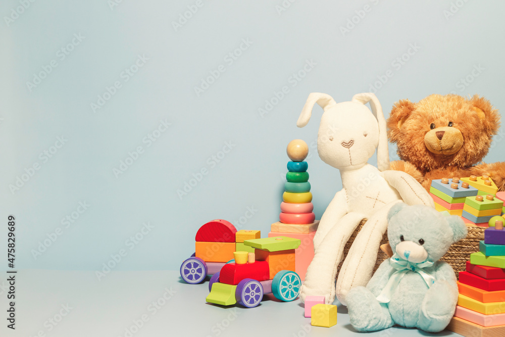 Toy box full of baby kid toys. Container with teddy bear, fluffy and ...