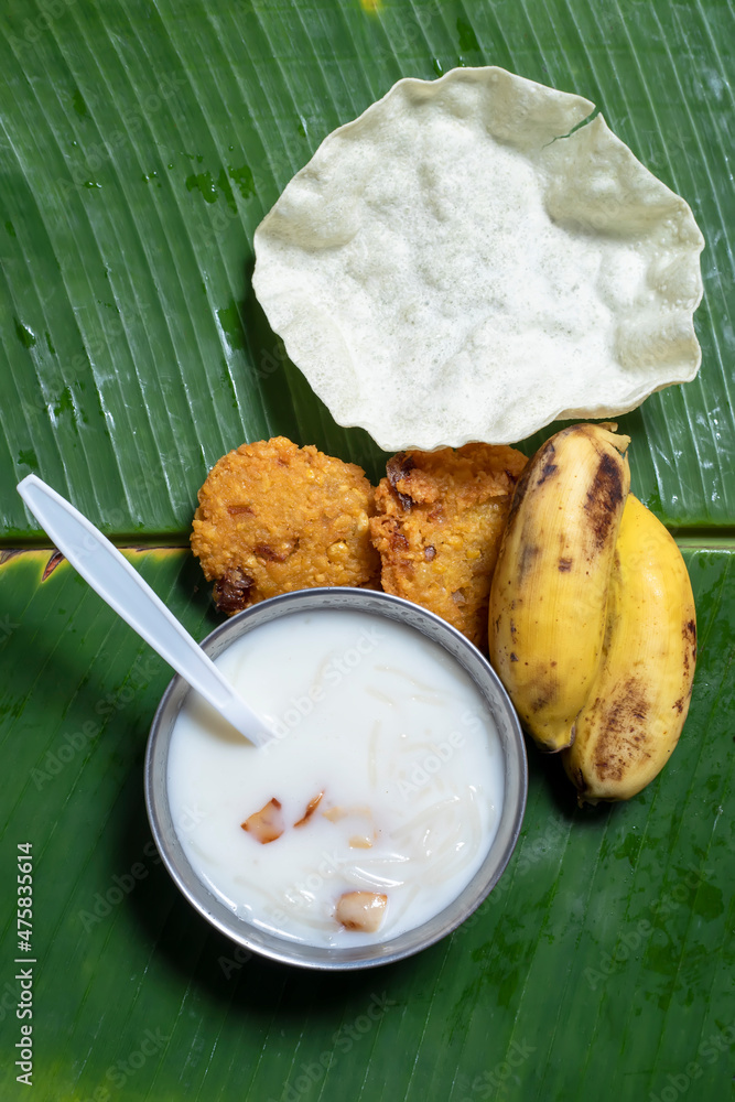Traditional Onam Sadya served on a banana leaf on Festival day in ...