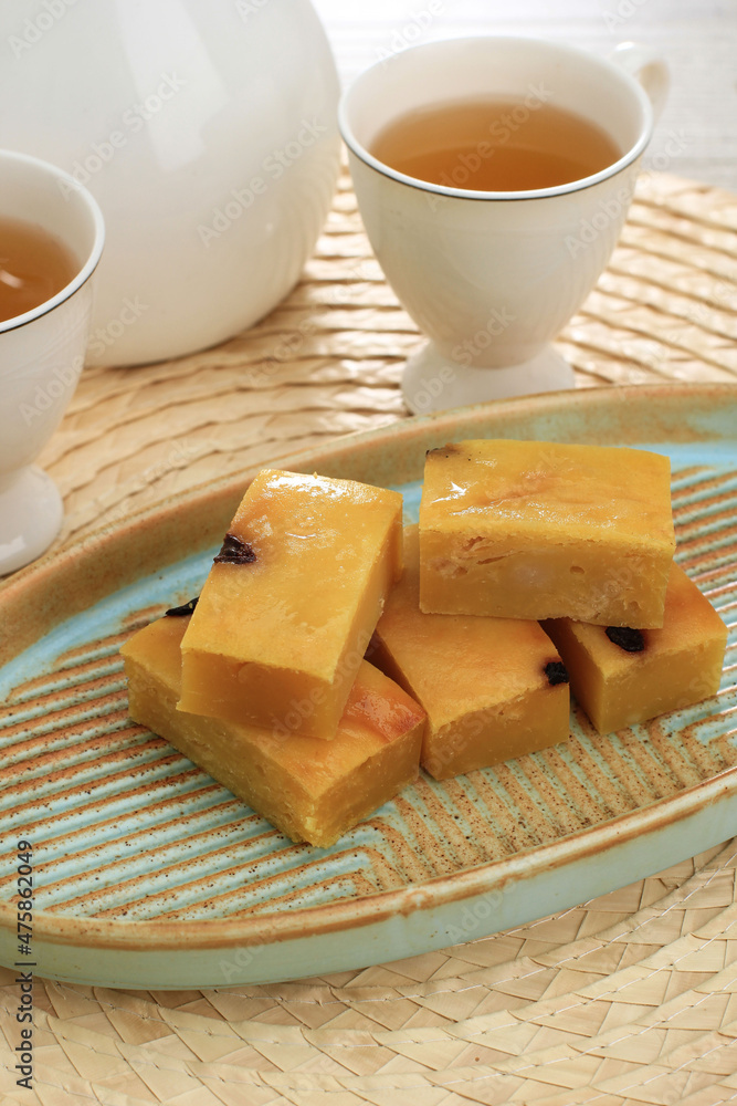 Sliced Homemade Prol Tape or Bolu Tapai on White Plate. Prol Tape is ...