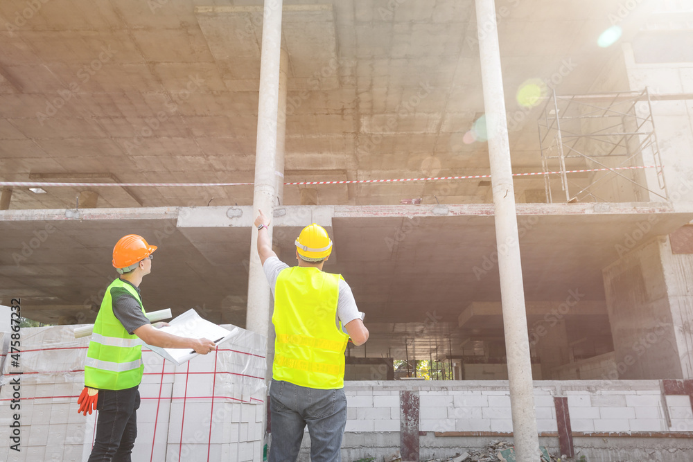 Confident team of architect working together in building construction ...