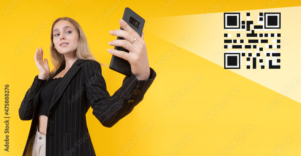 Scanning QR codes. Use of QR technology. Matrix code on yellow ...