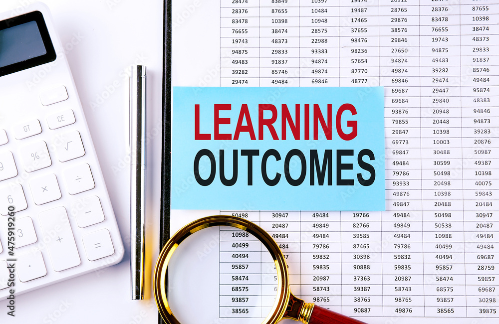 LEARNING OUTCOMES text on sticker on the chart background, business ...