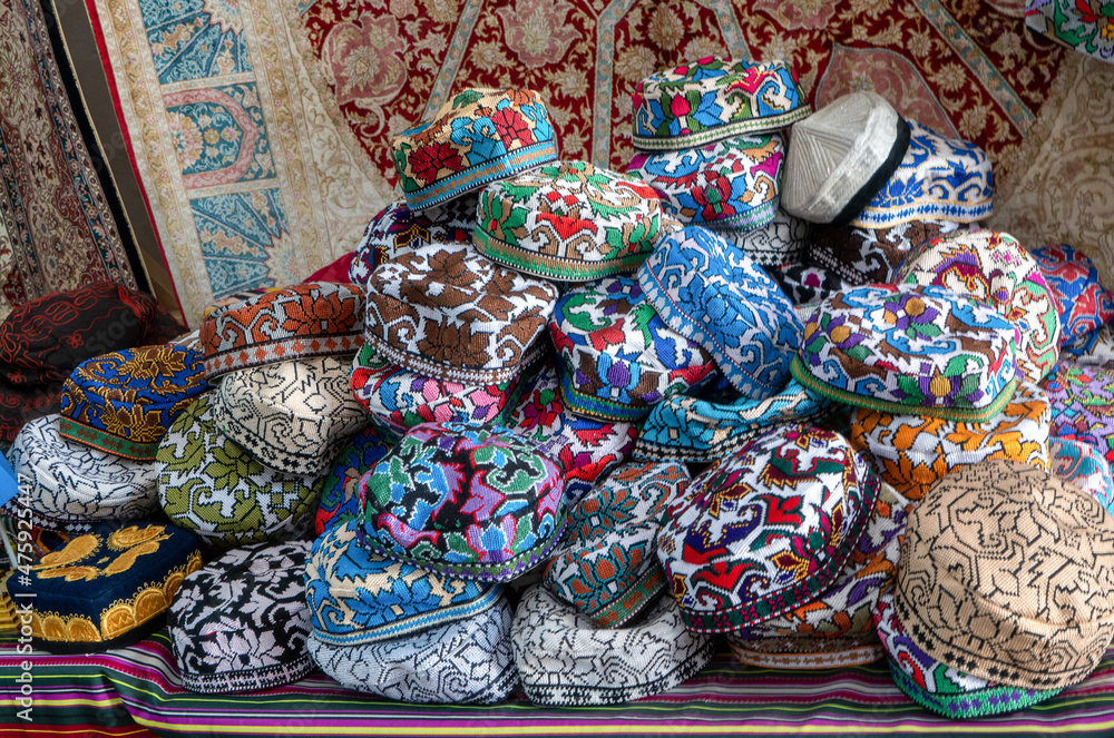 Uzbekistan, in the city of Bukhara, beautiful handmade traditional caps ...