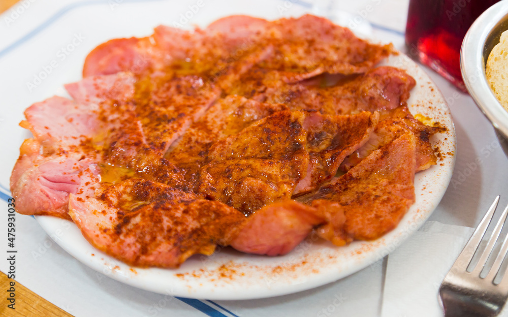 Image of tasty slices of lacon galician boiled pig ham served at plate ...