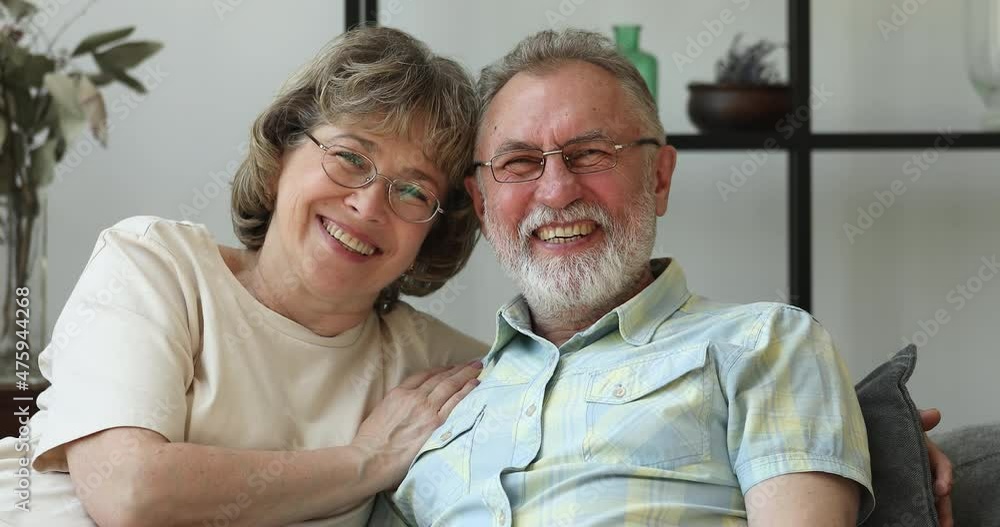 Stockvideo Headshot portrait of happy older age married couple ...