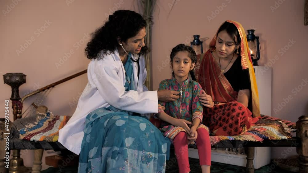 A female doctor from a local medical center doing checkup of a young ...
