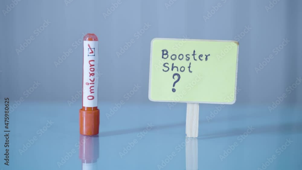 Booster shot question mark sign board placing next to Omicron Blood ...