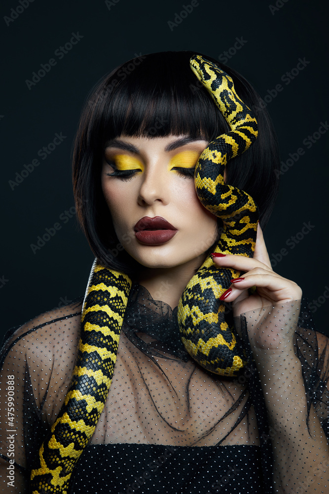 Beauty woman short haircut python yellow snake on her neck. A yellow ...