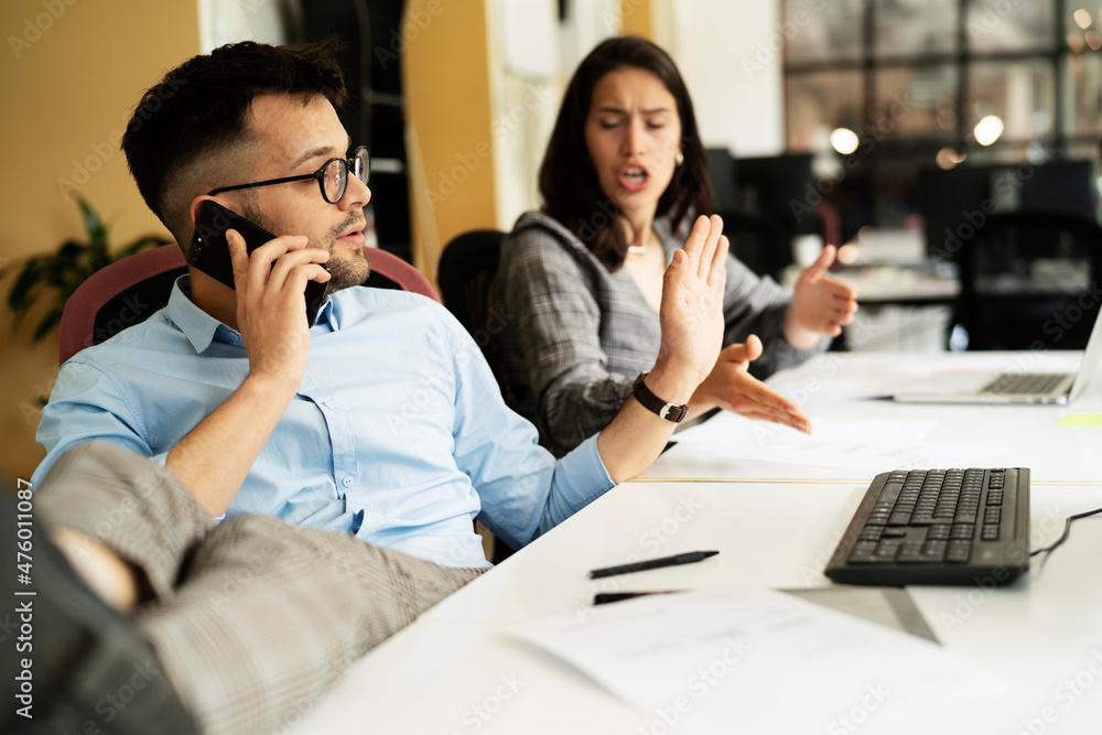 Colleagues arguing in office. Angry businesswoman yelling at her ...