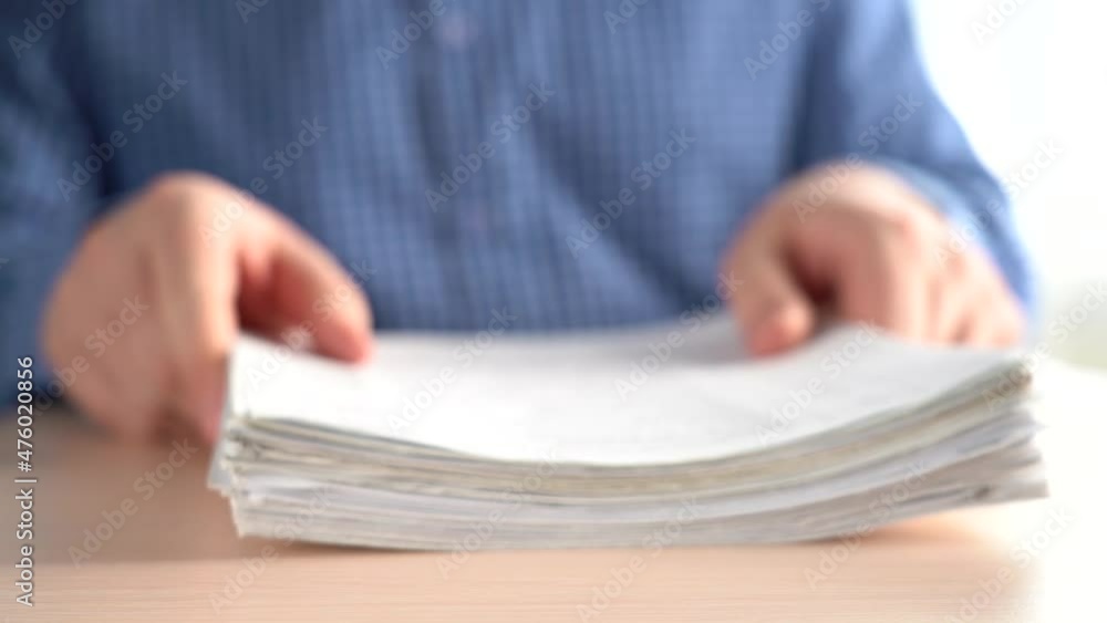 A Stack Of Paper Files Falls On The Table. Office work concept. Camera ...