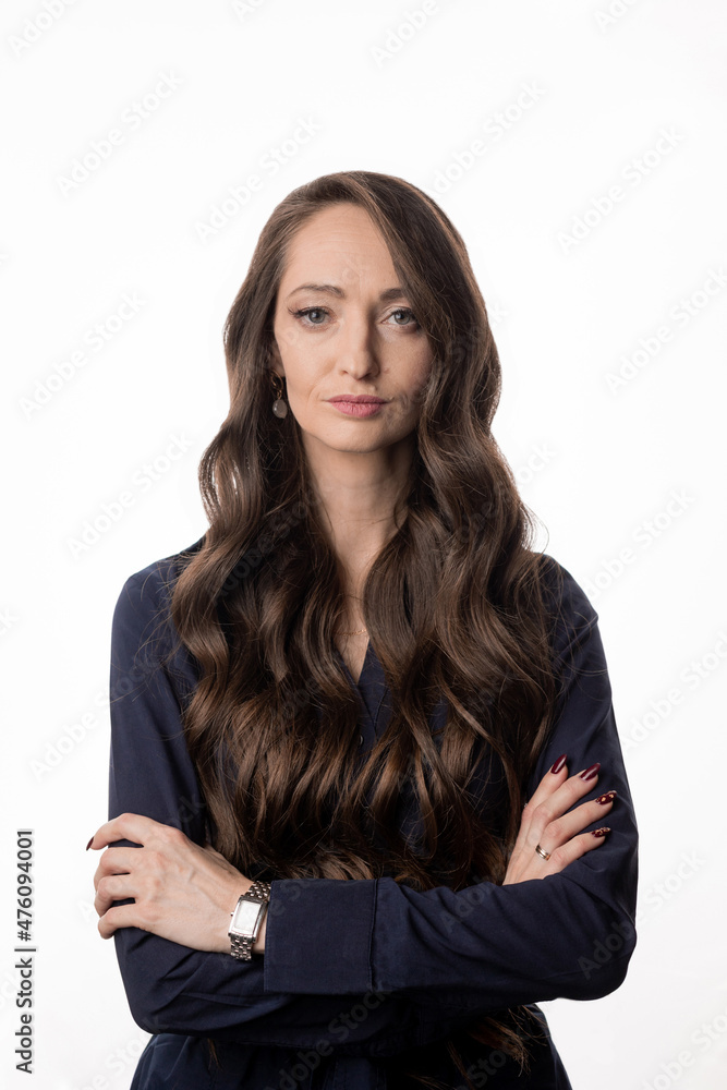A serious girl, office worker, manager, director with long curls and in ...