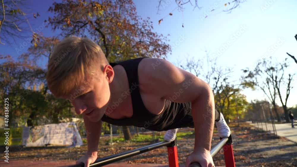 Muscular man doing on sunset sky background. Calisthenics, healthy ...