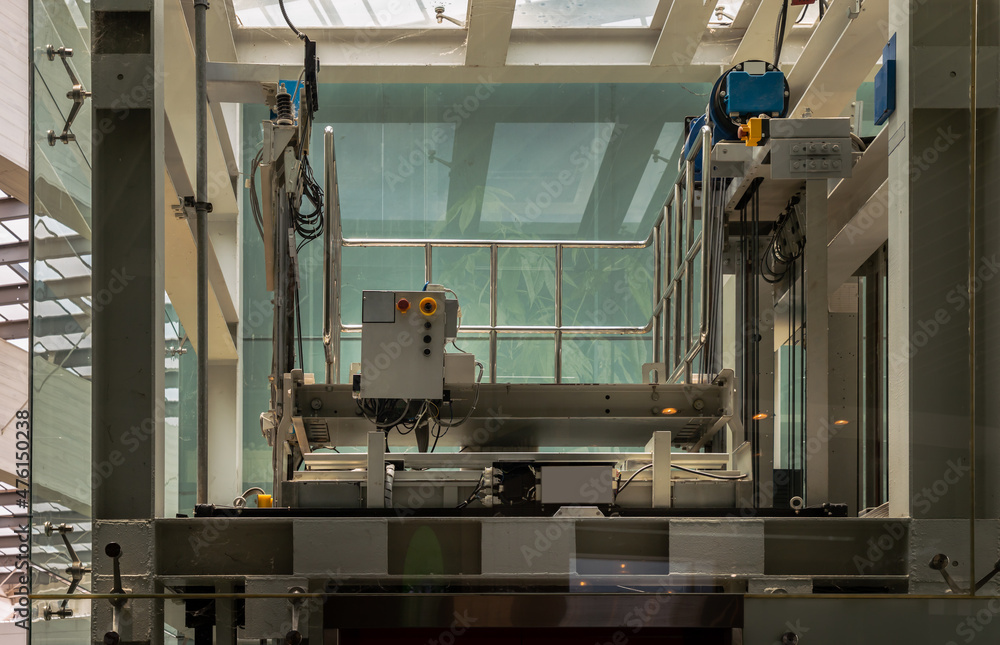 Elevator engine glass room with elevator motor. Motor driven Elevator ...
