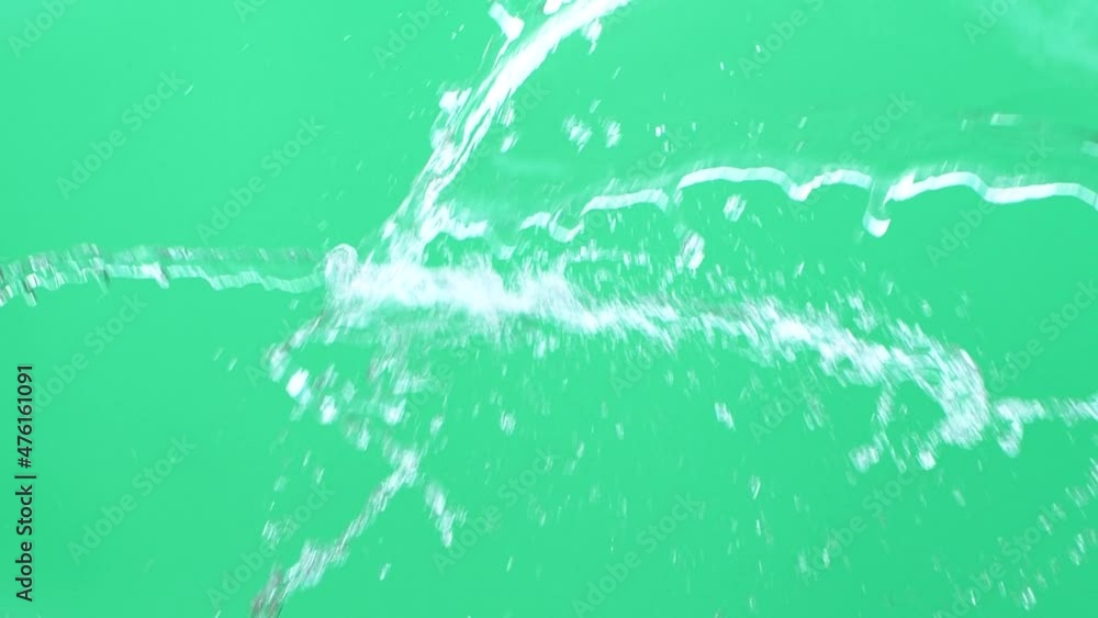 Slow motion of water spash with drops over green screen chroma key ...