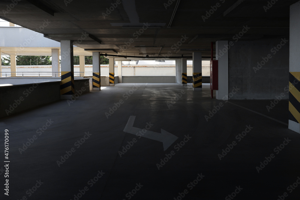 Empty open car parking garage with warning stripes on columns Stock ...