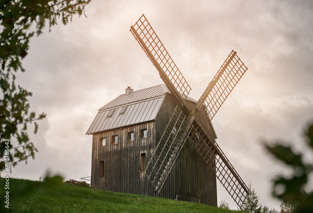 Moody photo of a classic vintage windmill Stock Photo | Adobe Stock