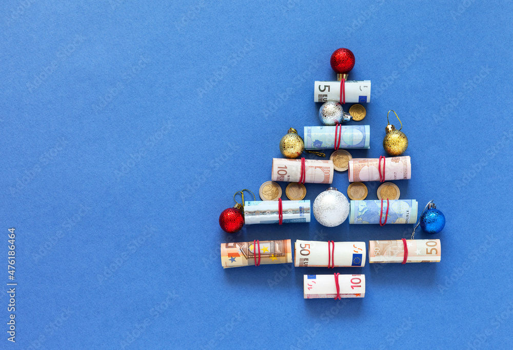 Unusual Christmas tree made of twisted euro banknotes decorated with ...